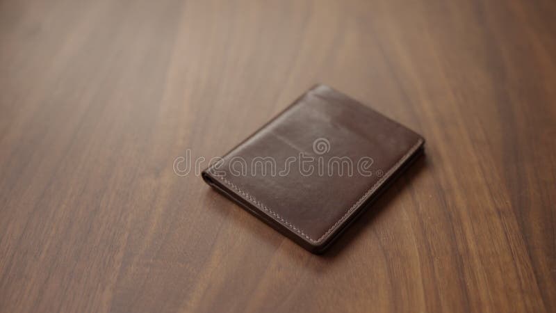 Brown Bespoke Leather Wallet on Walnut Wood Table Stock Photo - Image ...