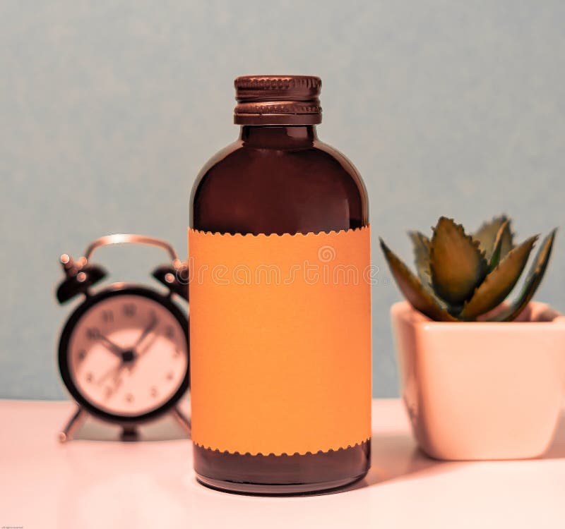 Brown Bottle with Yellow Label Stock Photo - Image of bottle, cold ...