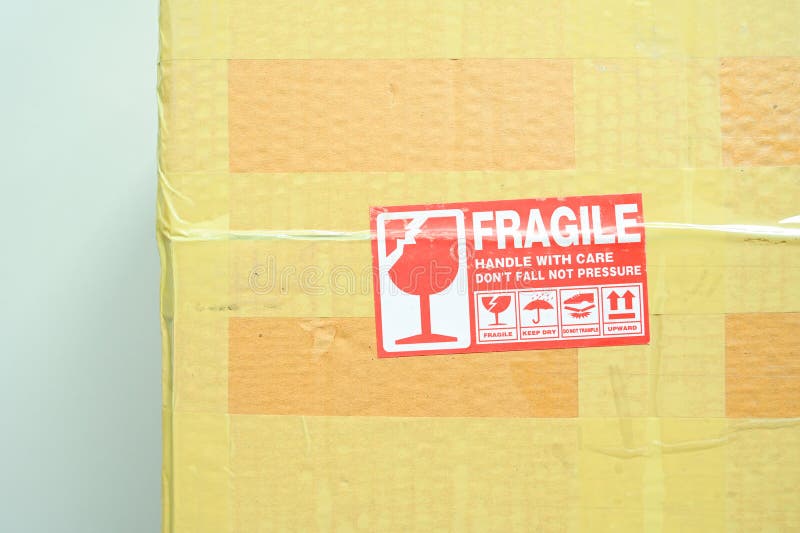 Brown Box Packaging with Warning Symbol Stock Photo - Image of ...