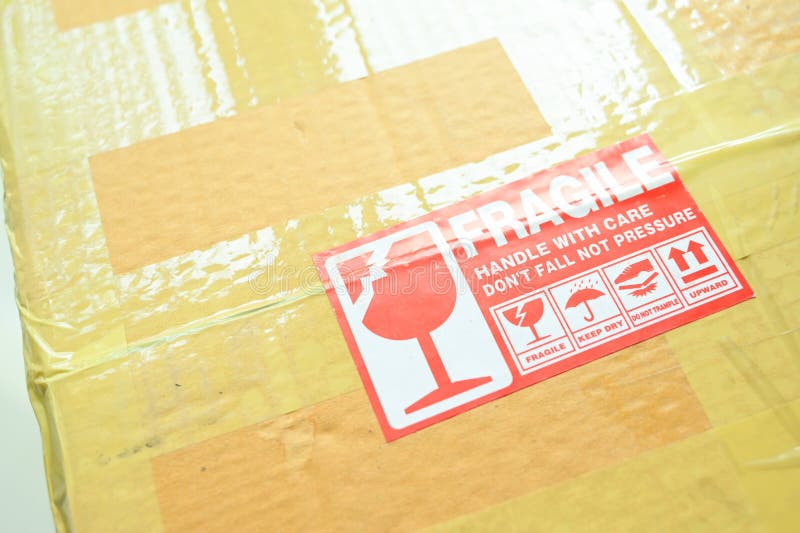 Brown Box Packaging with Warning Symbol Stock Photo - Image of postal ...