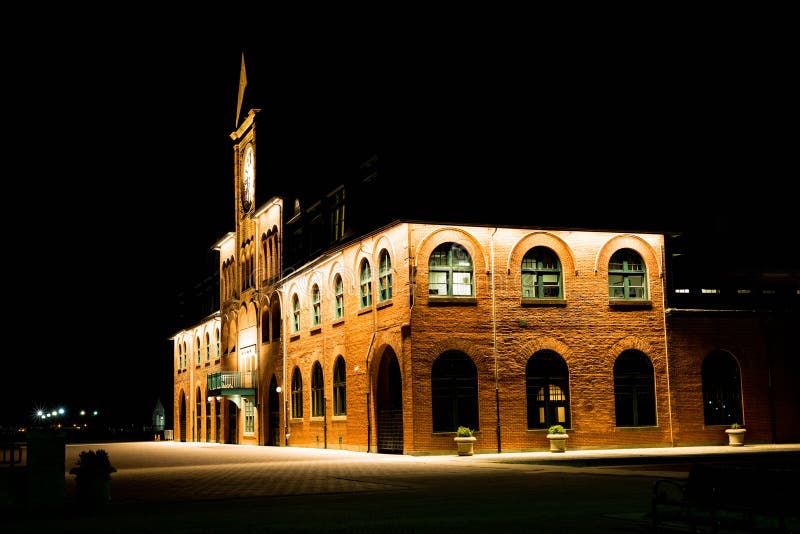 Brown Brick Building With Lights During Night Time Picture. Image ...