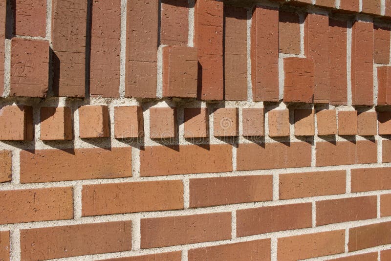 Brown Brick Wall Texture Background with Header of Protruding Bricks in ...