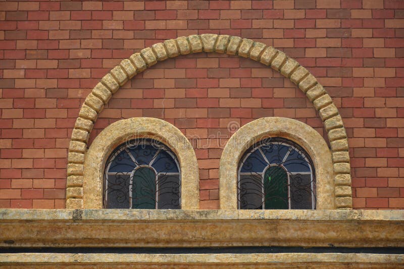 Brown Bricks With Stained Glass Window Arch Design Stock Image - Image ...