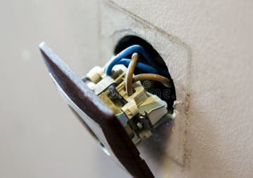 Brown Broken Electrical Socket Fell Out of the Wall. Stock Photo ...
