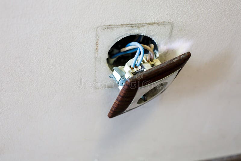 Brown Broken Electrical Socket Fell Out of the Wall. Stock Photo ...