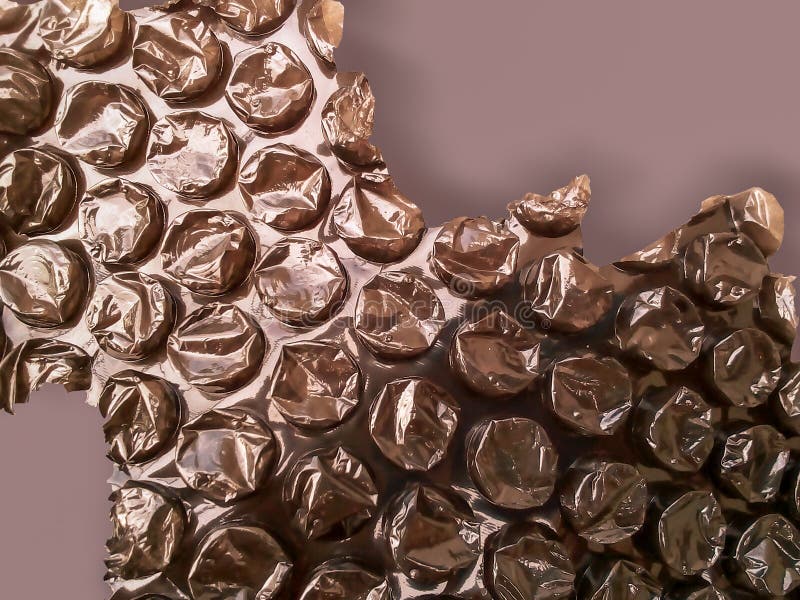 Brown Bubbled Plastic with Shreds Effect on Brown Background Stock ...