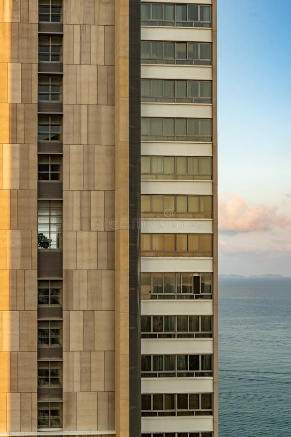 Brown Building Overlooking Ocean with a Clear Sky Stock Image - Image ...