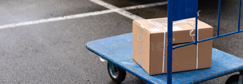 Brown Cardboard Moving Box in the Cart Stock Photo - Image of storage ...