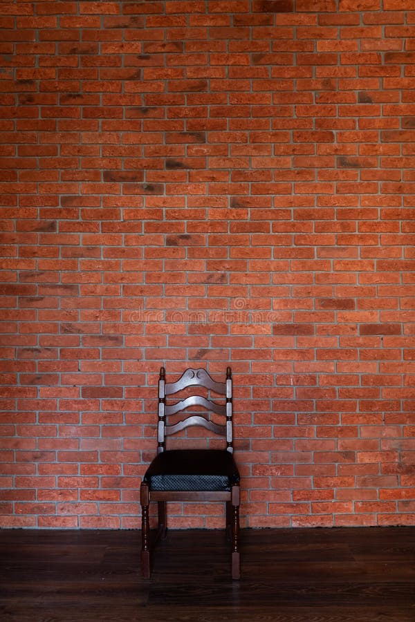 Brown Chair on a Brick Wall in a Room Interior Minimalism Stock Photo ...