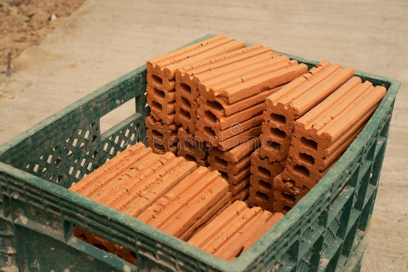 The Brown Clay Rectangular Bricks in a Green Plastic Box Stock Photo ...