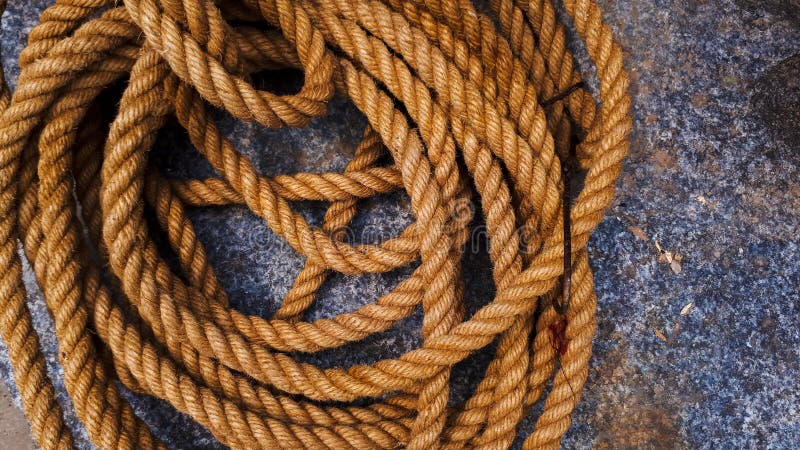 Brown Colored Reinforced Jute Rope on a Rock Stock Image - Image of ...