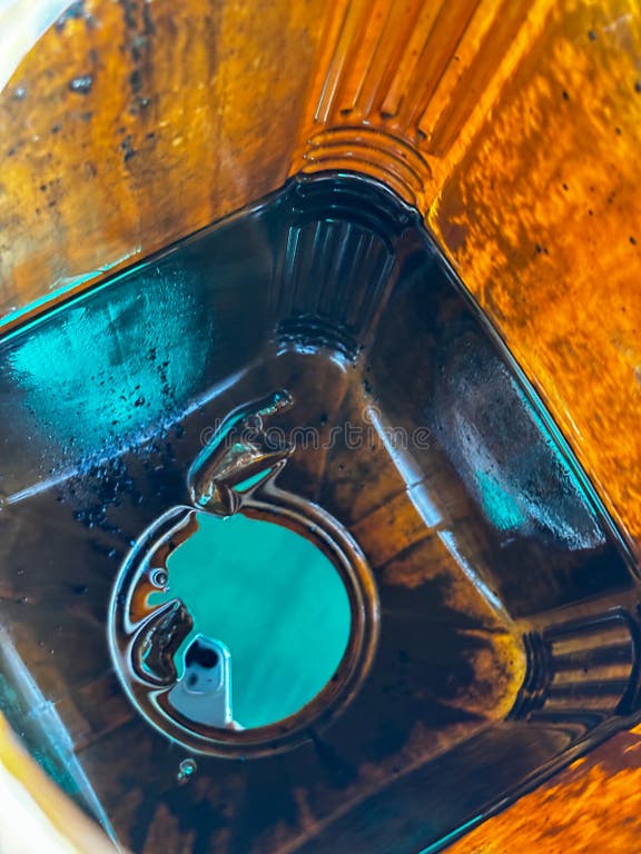A Brown Container with a Green Liquid Inside Stock Photo - Image of ...