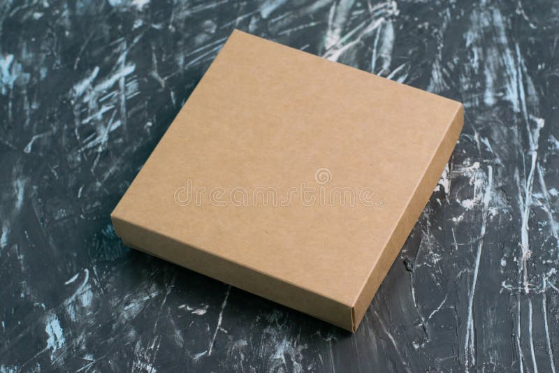 Brown Craft Box on a Dark Gray Background. Gift Selection Concept Stock ...