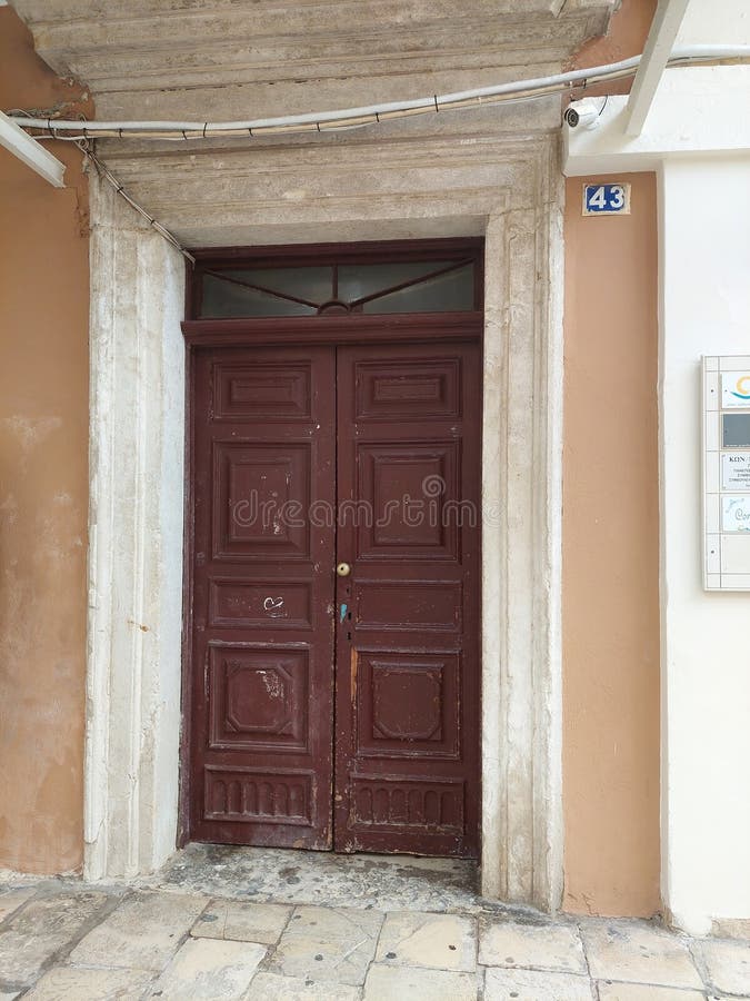 A Brown Double Doorway Closed and Uninviting Editorial Stock Image ...