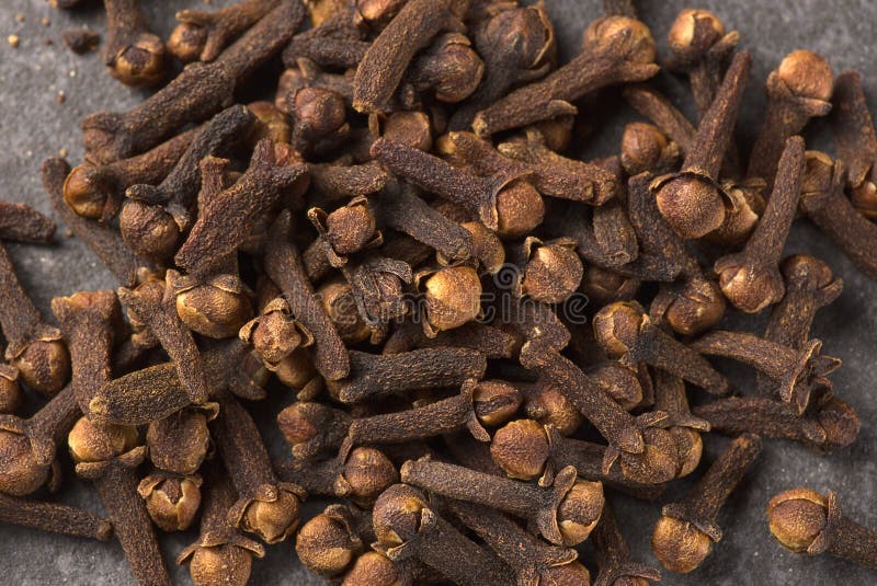 Brown Dried Cloves, Textured on a Gray Stone Stock Image - Image of ...