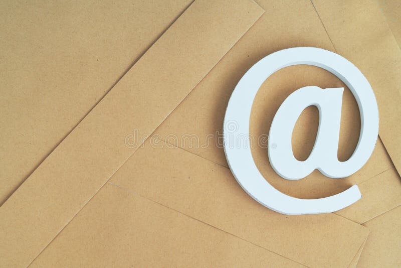 Email Simbol at Sign on Brown Envelopes Background Stock Image - Image ...