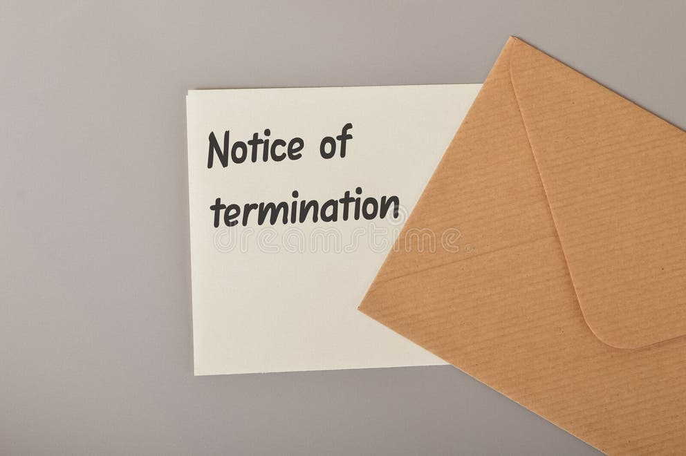Brown Envelope and White Paper Written with NOTICE of TERMINATION Stock ...