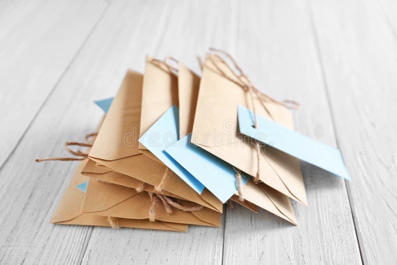 Brown Envelopes with Tags on Wooden Table. Mail Service Stock Photo ...