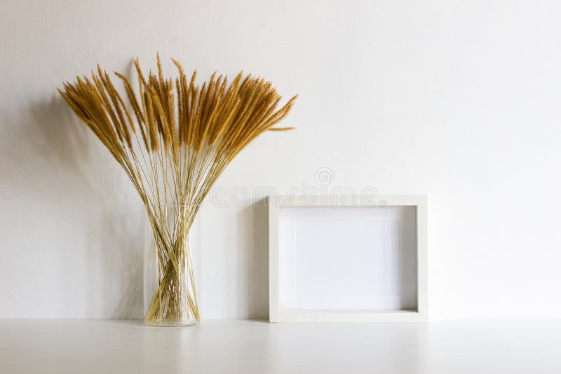 Brown Flowers and White Frame Over the Table with Natural Light. Stock ...