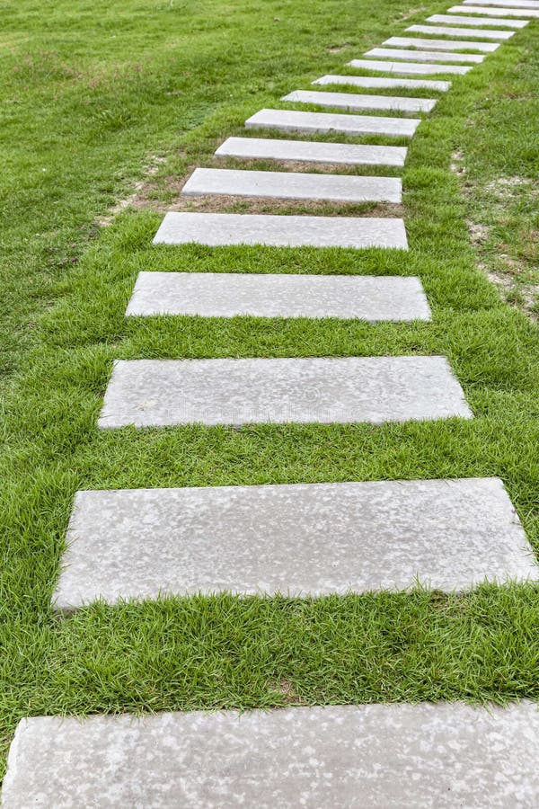 Granite Walkway Slabs Patterned in Green Lawns at the Garden Stock ...