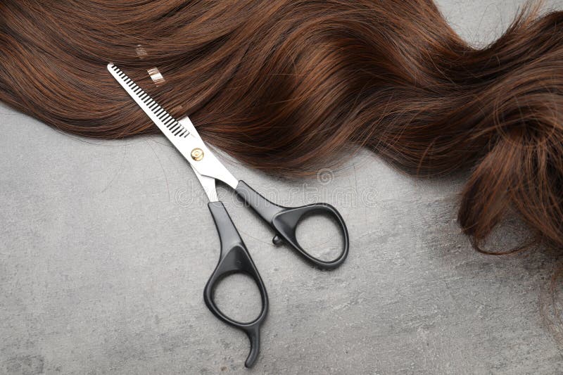 Brown Hair Strand and Professional Scissors on Grey Surface, Flat Lay ...