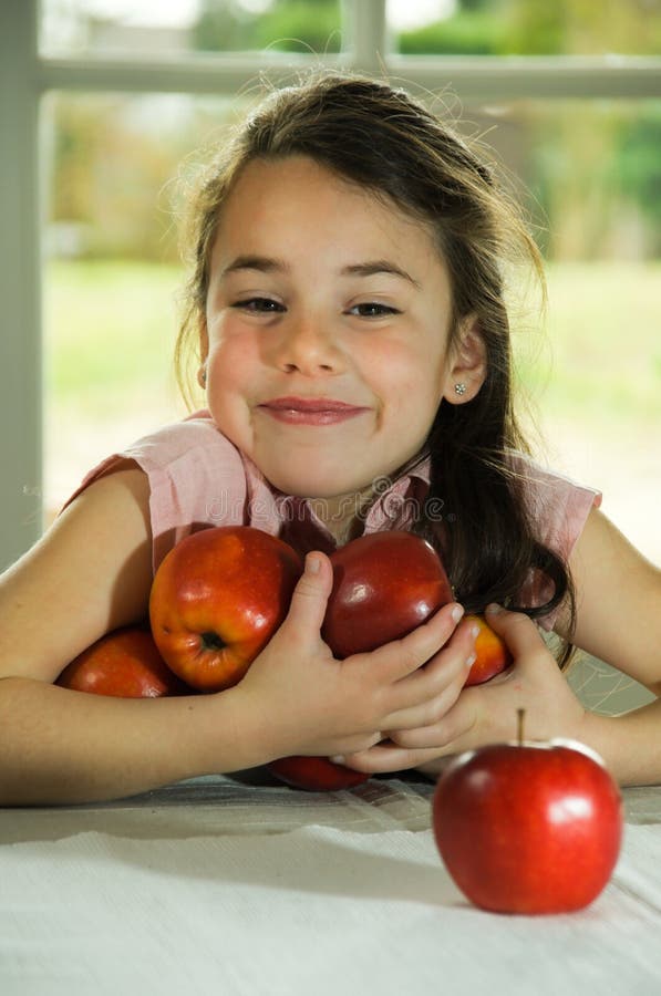 4+ Brown haired child holding apple Free Stock Photos - StockFreeImages