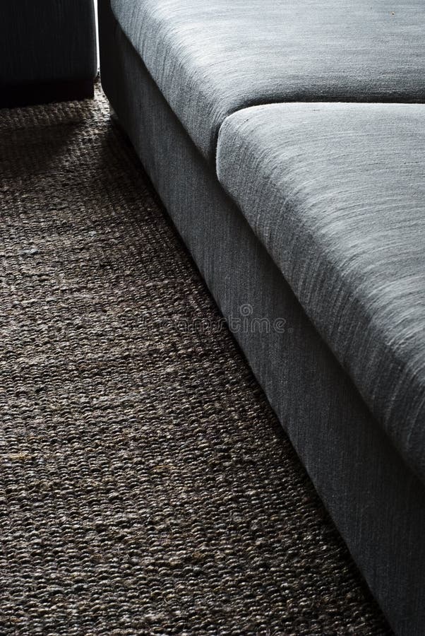 Brown Hemp Rug and Fabric Couch Setting Stock Photo - Image of textiles ...