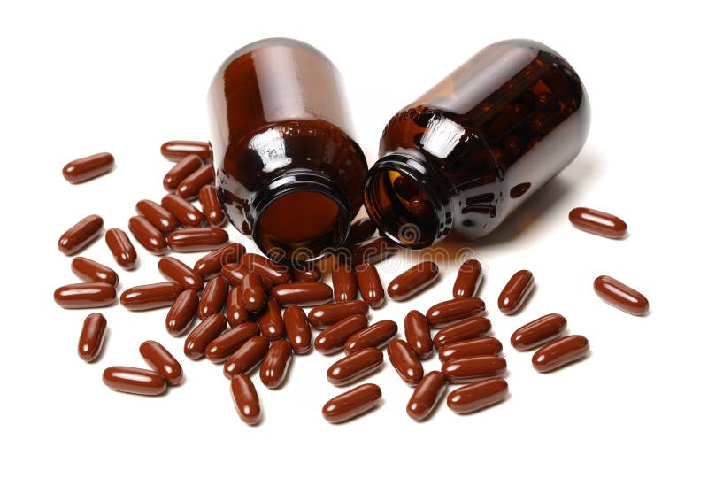 Brown-Kapseln stockfoto. Bild von dosis, stapel, glas - 145449430