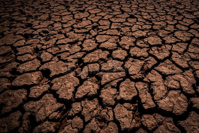 Brown Land, Clay Loam Covered with Deep Cracks in the Dark Stock Photo ...