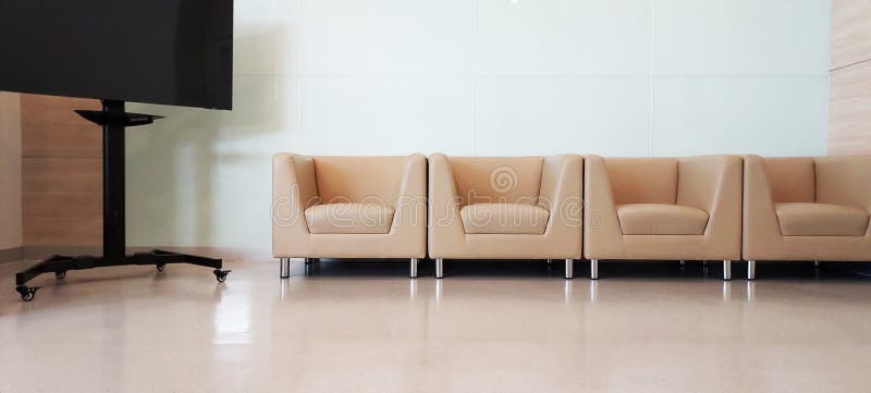Brown Leather Chairs is Placed in the Corner of the Reception Room ...