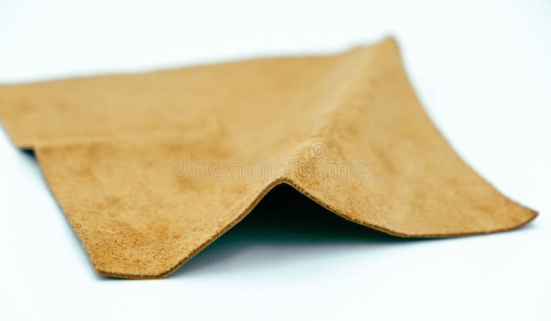 Piece of Brown Leather and Suede Cut on White Background. Concept and ...