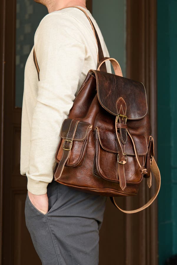 Brown Leather Oldfashioned Backpack on a Mans Back Stock Image - Image ...
