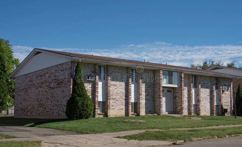 Brown & Tan Brick Low Income Apartment Building Stock Photo - Image of ...