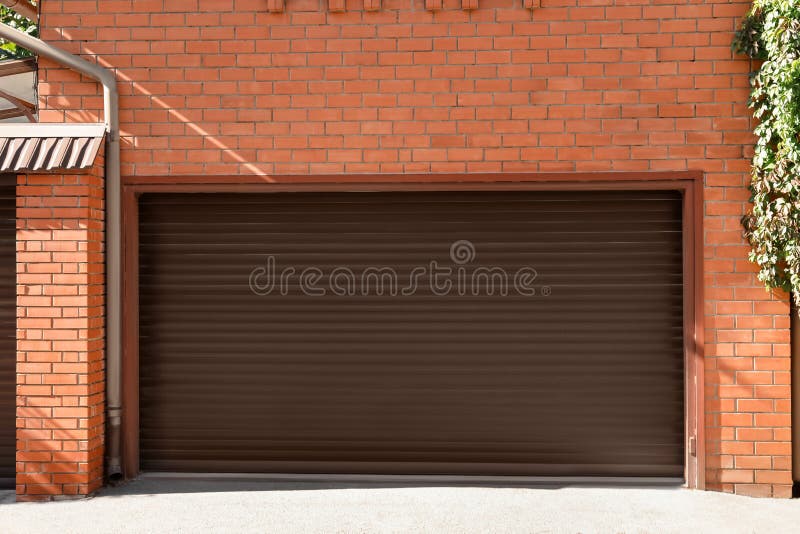 Brown Modern Roller Garage Doors on Building Stock Photo - Image of ...