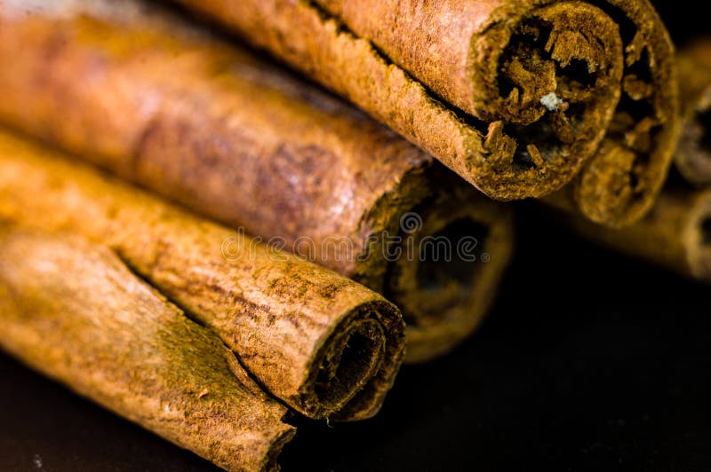 Brown Natural Cinnamon Sticks on Black Background, Close Up, Macro ...