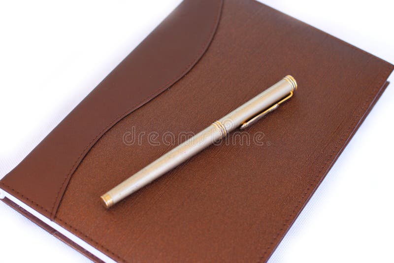 Brown note book and pen stock photo. Image of office - 37565118