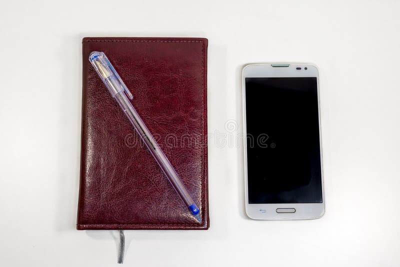 Brown Note with Pen and Phone on the Table Stock Photo - Image of empty ...