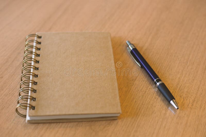 Brown Notebook with Pen on Wooden Stock Image - Image of open, notepad ...