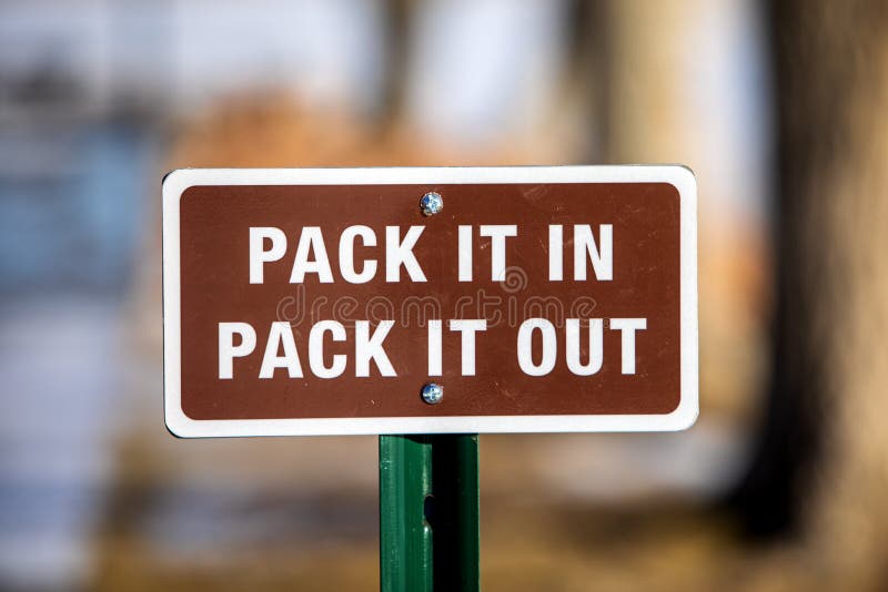 A Brown, Pack it in, Pack it Out Sign with White Lettering and White ...