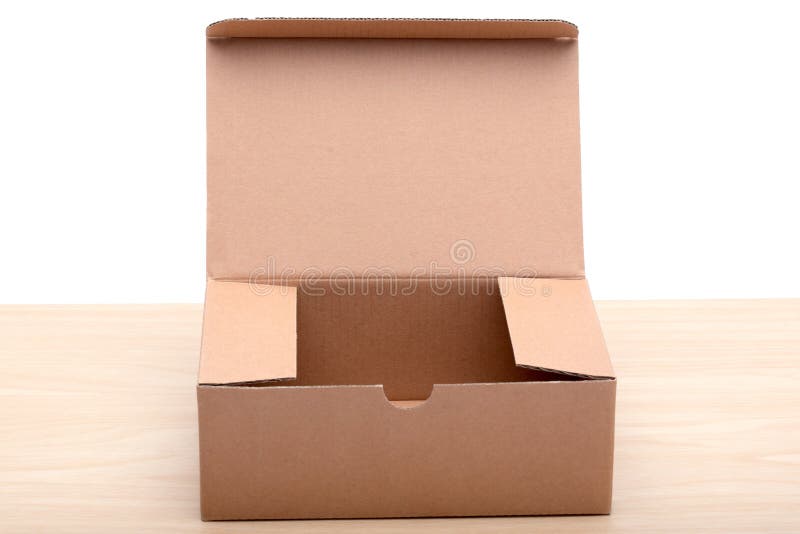 A Brown Package Box on Wood Board on White Blackground Stock Image ...