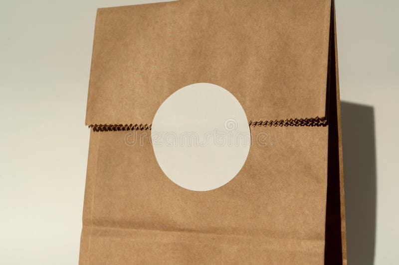 Brown Paper Bag with White Round Sticker on Fold Stock Photo - Image of ...