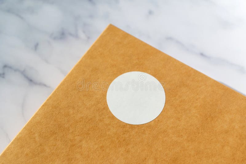 Brown Paper Box with Round White Sticker on Marble Surface Stock Image ...