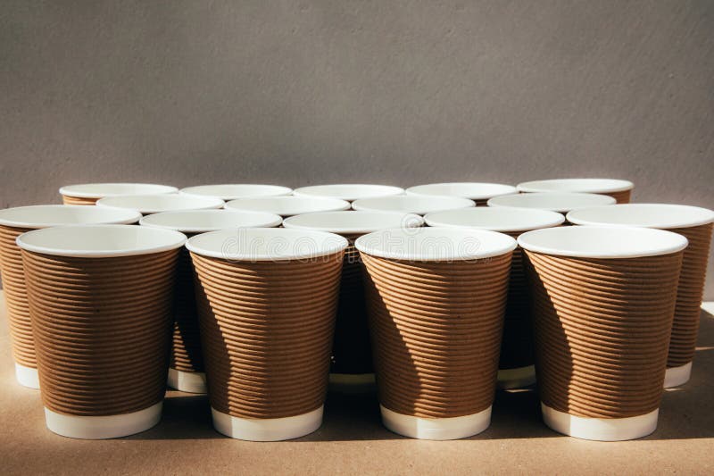 A Brown Paper Cups on a Brown Cardboard Background. Eco Friendly, Zero ...