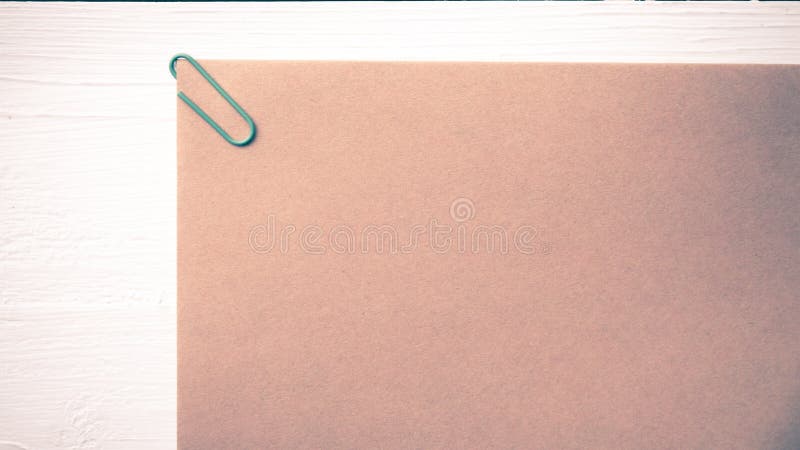 Brown Paper with Green Paper Clip Vintage Style Stock Image - Image of ...