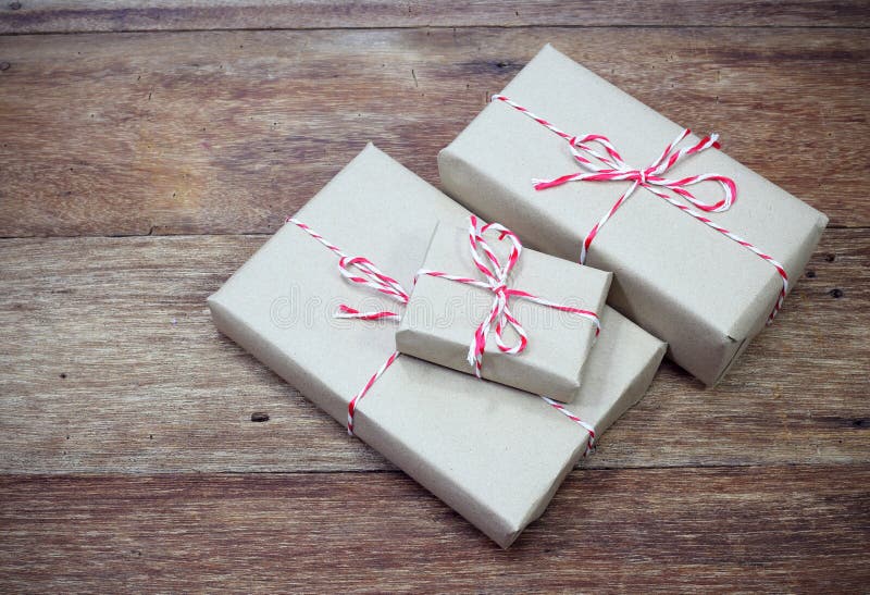 Brown Paper Parcel Tied with Red and White String Stock Image - Image ...