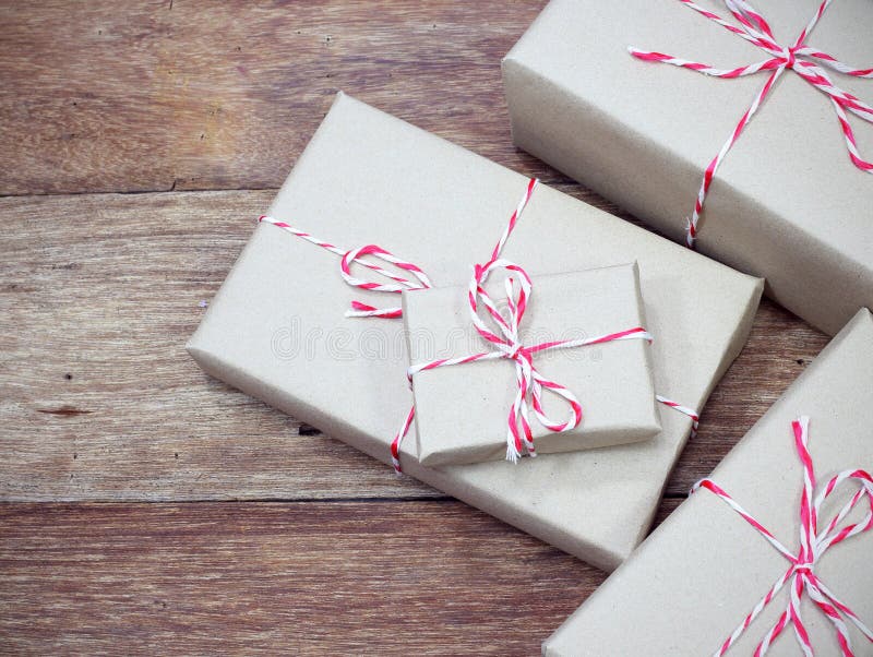 Brown Paper Parcel Tied with Red and White String Stock Image - Image ...