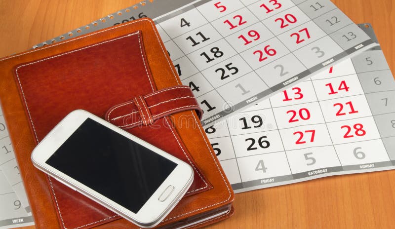 Brown Personal Organizer or Planner with a Mobile Phone and a Calendar ...