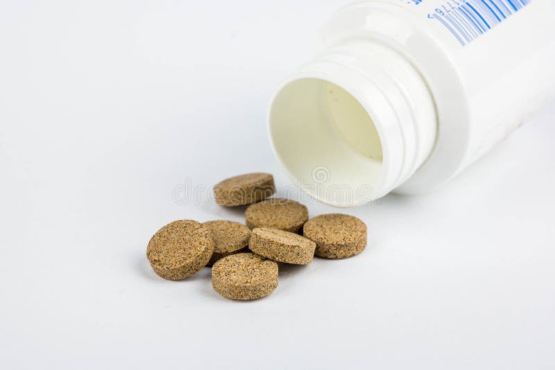 Brown Pills and Plastic Jar Stock Photo - Image of brown, pill: 44734528