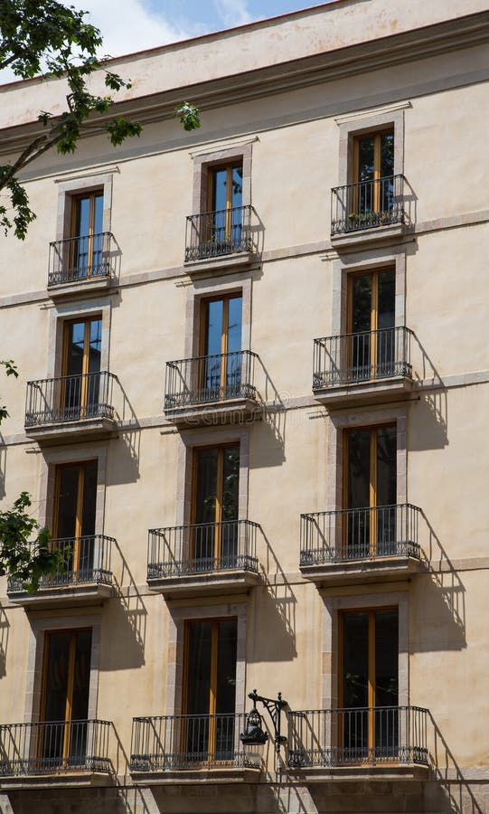Brown Plaster Hotel with Iron Balconies Stock Image - Image of spanish ...