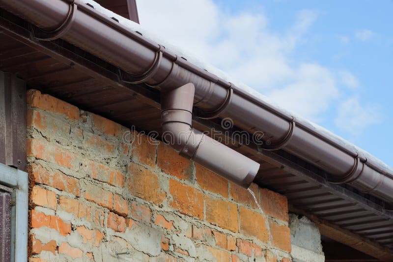 Brown Plastic Gutter Pipe on Red Brick Wall Stock Image - Image of blue ...